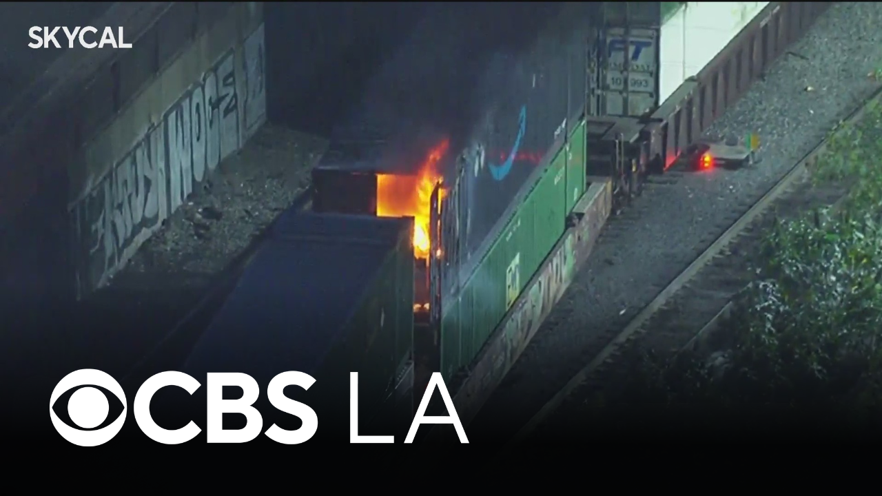 Cargo container catches fire on moving train in downtown Los Angeles