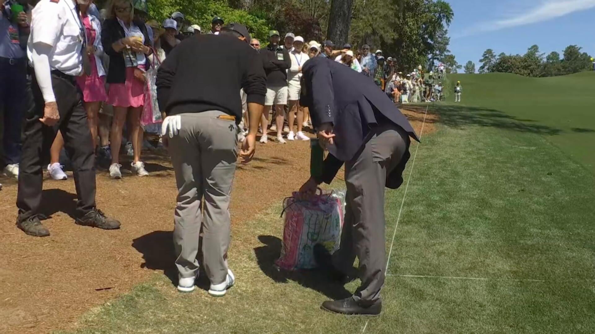Xander Schauffele takes drop after driving ball into patron's ...