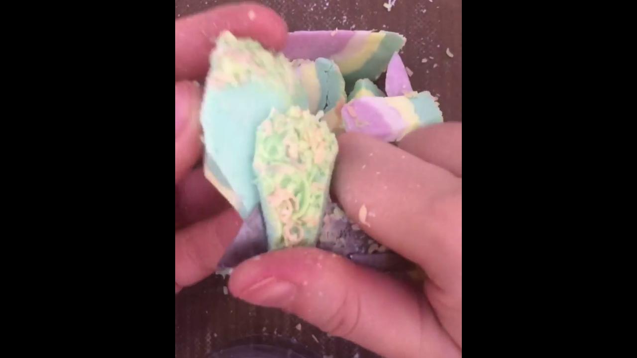 Creating rainbow layer soap slices with purple, yellow, green, and blue ...