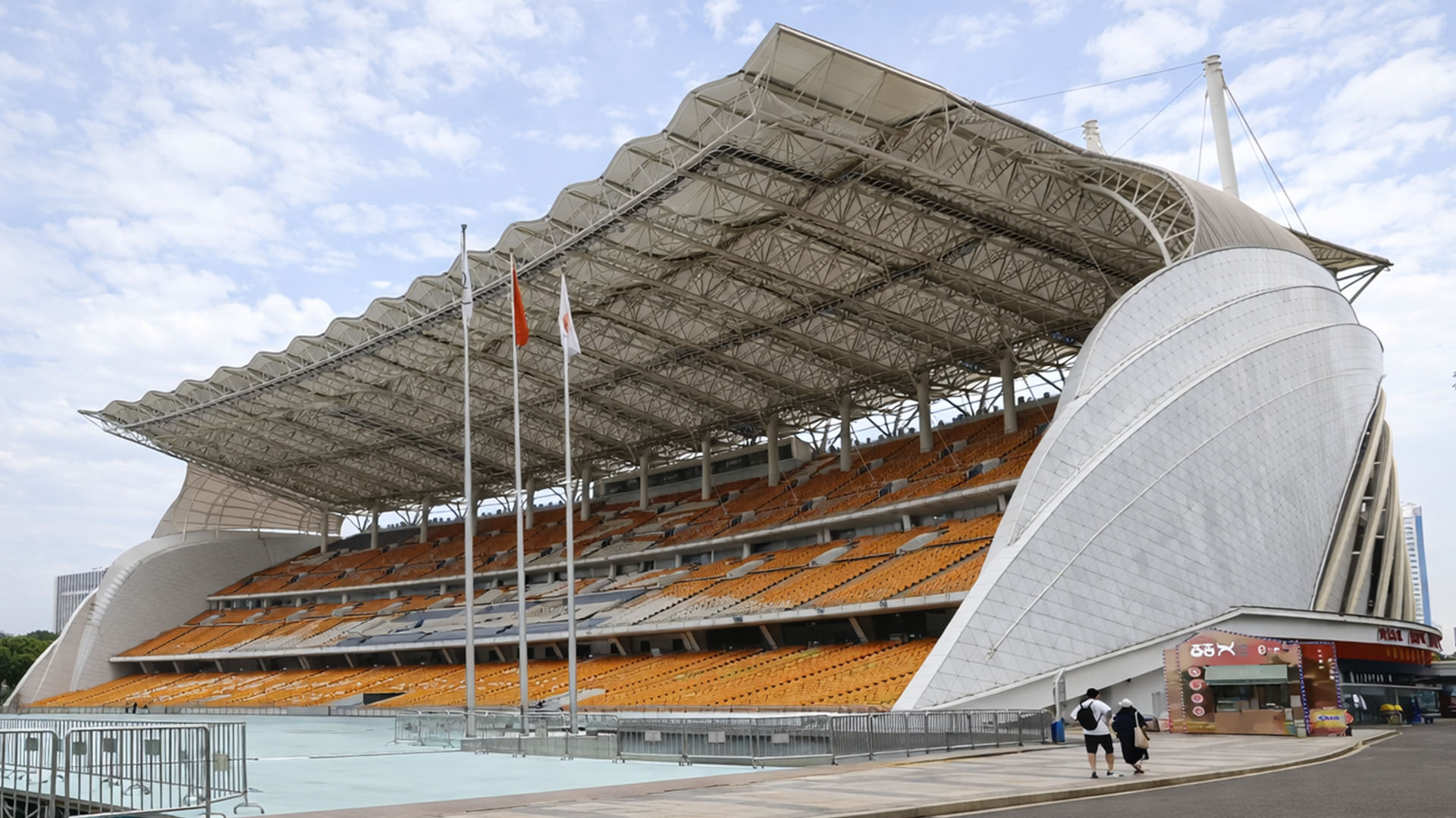 Distinct stadium structure in China stands with a massive roof design