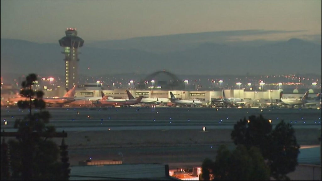 FAA investigates close call between Frontier plane and trucks at LAX