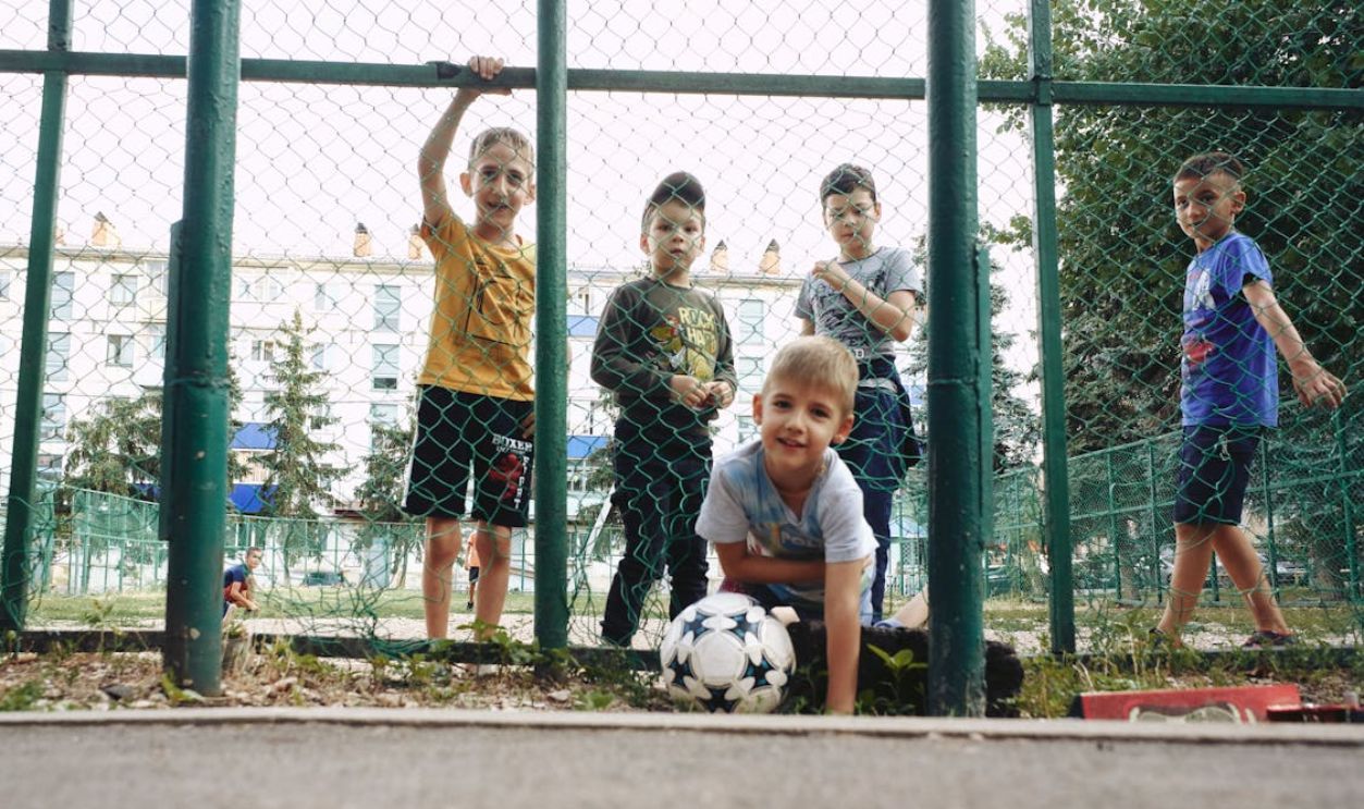 My kids keep kicking their ball over our elderly neighbor's wall. He's ...