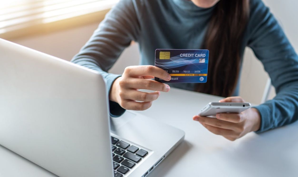 My coworker says credit cards are a scam and refuses to use them at all ...