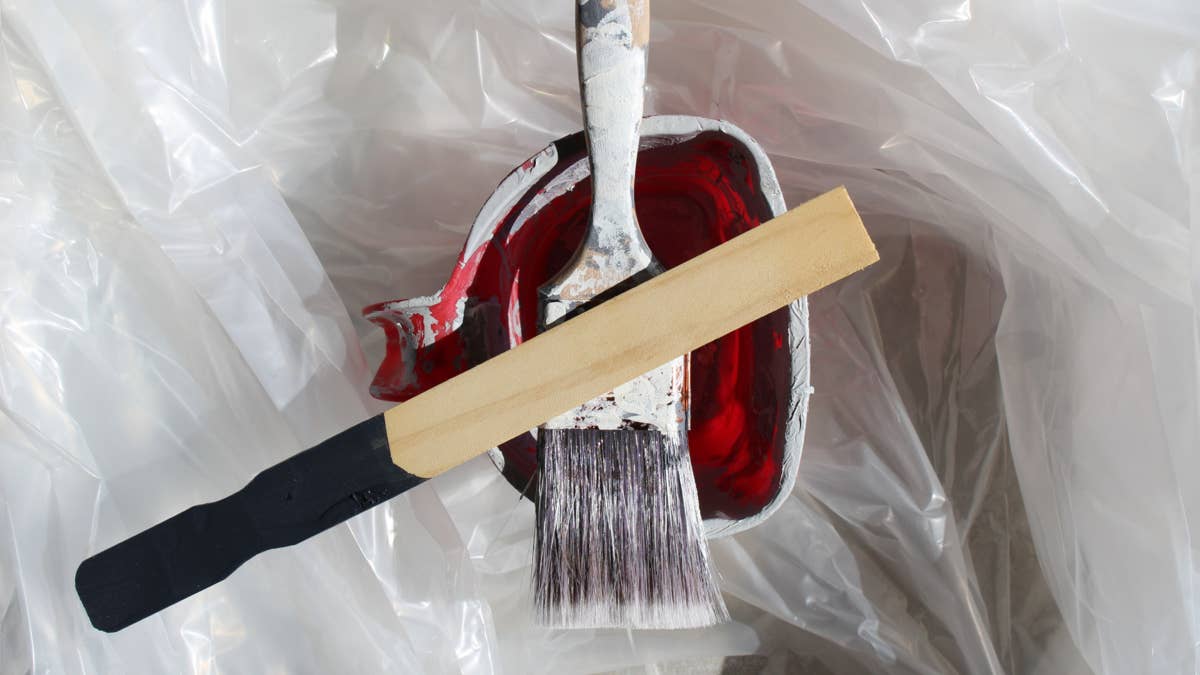 This simple trash bag hack saves leftover paint without the mess