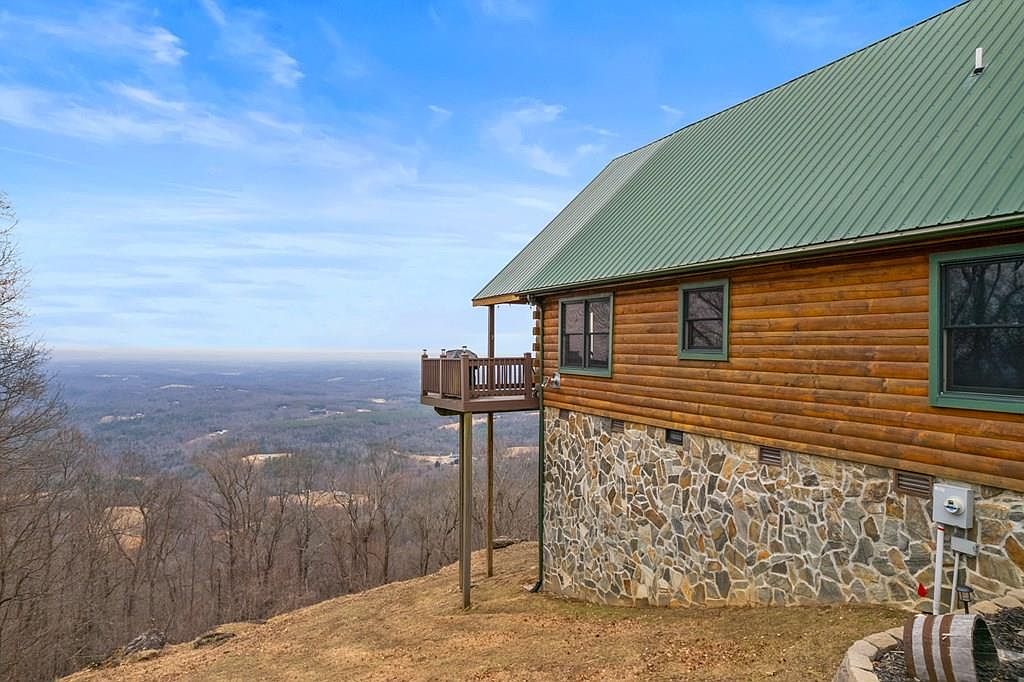 Experience tranquil mountain living in a 2008 rustic retreat in Fancy ...