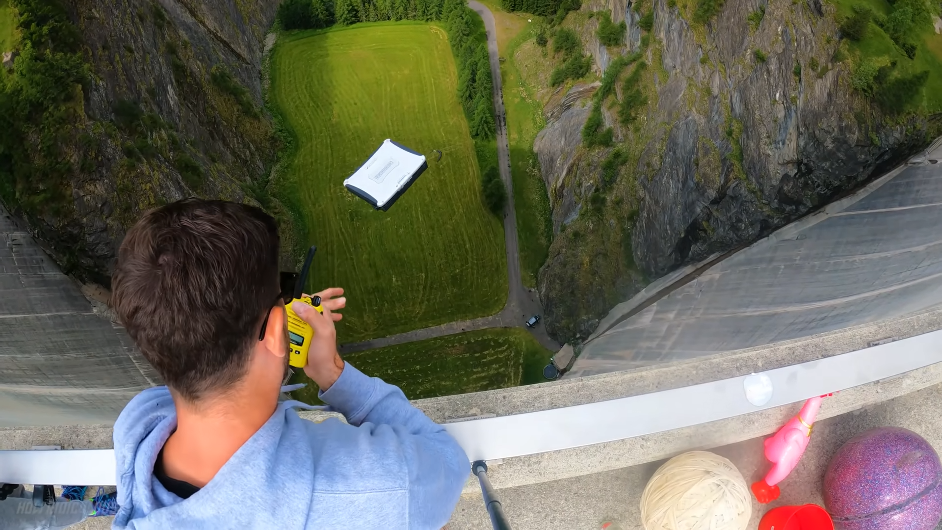 Watch what happens when a laptop falls off a 550 ft dam