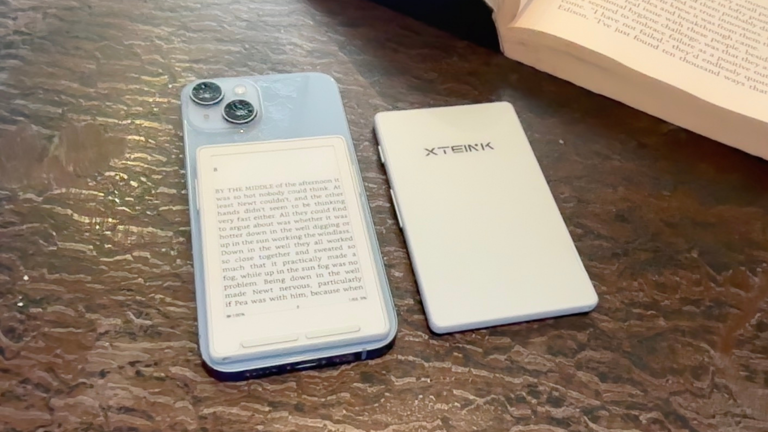 I'm reading a 900-page novel on an e-reader the size of my library card ...
