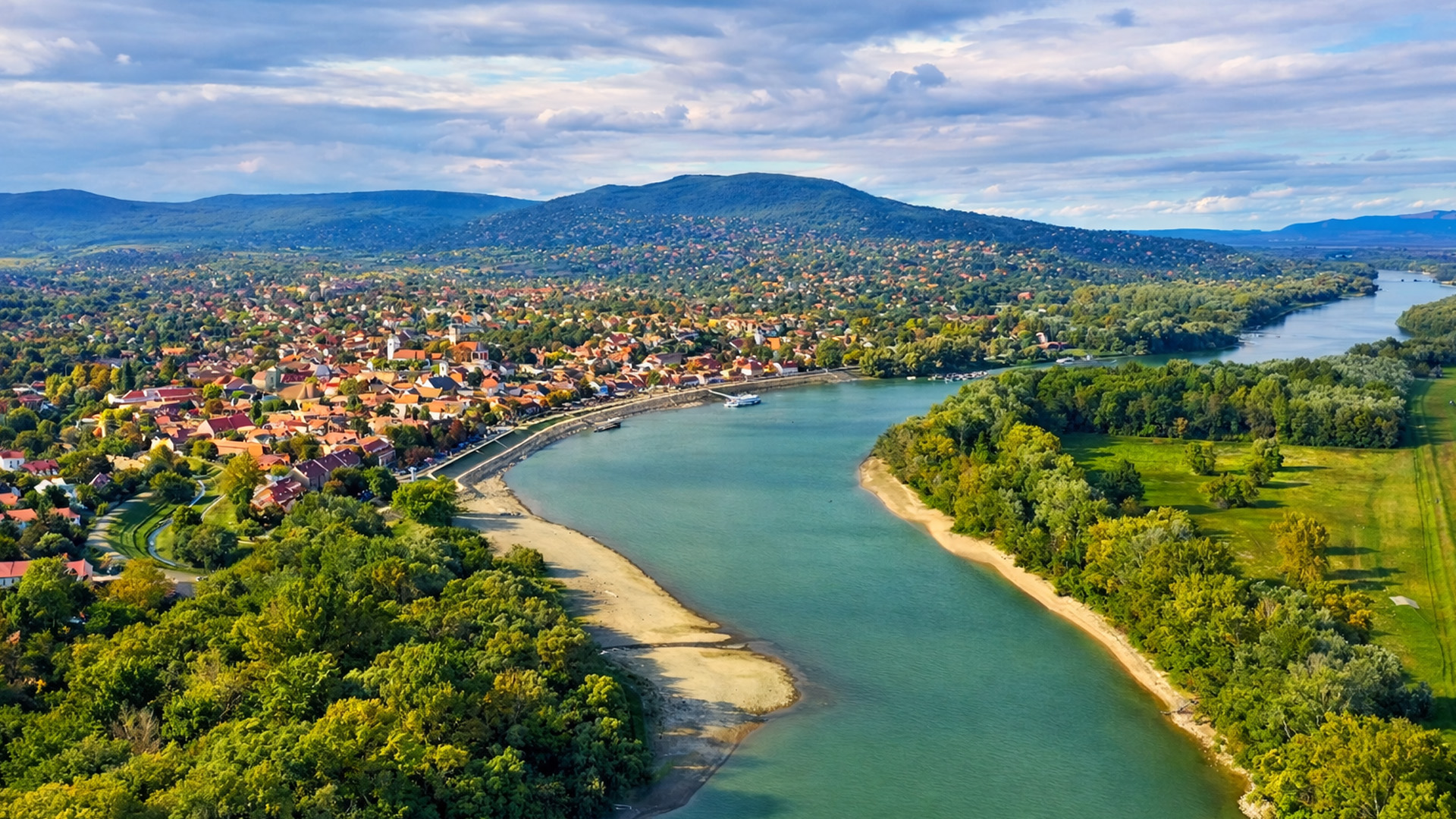 A riverside town with colorful streets and artistic charm