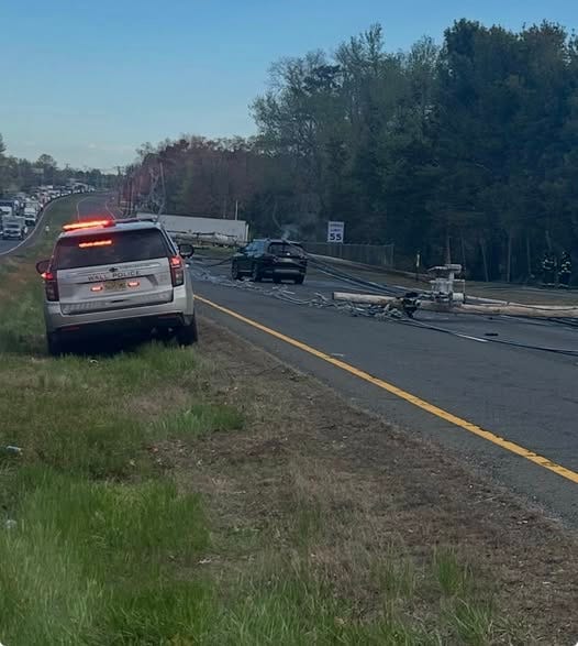 Tractor-trailer in Wall pulls down live wires on four vehicles