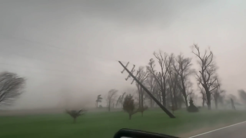 Storm chasers intercept tornado in Illinois as it downs power poles