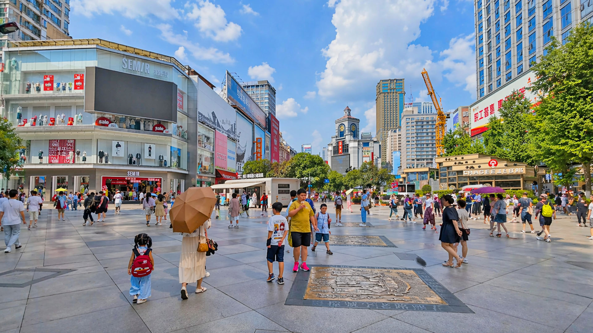A crowded city center that seems chaotic yet feels well organized