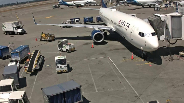 Seattle airport ramp worker sues after tug crash; Port of Seattle says ...