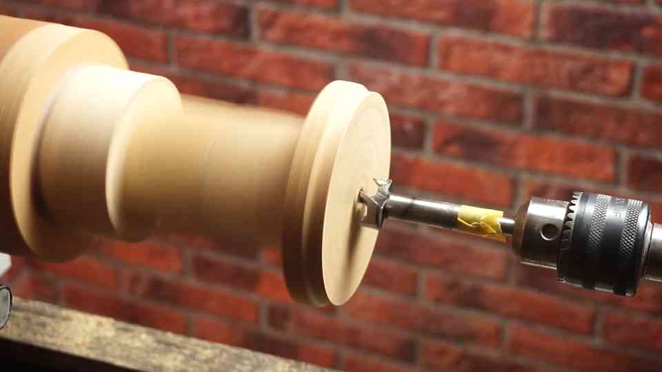 Woodturning walnut shells into a lamp