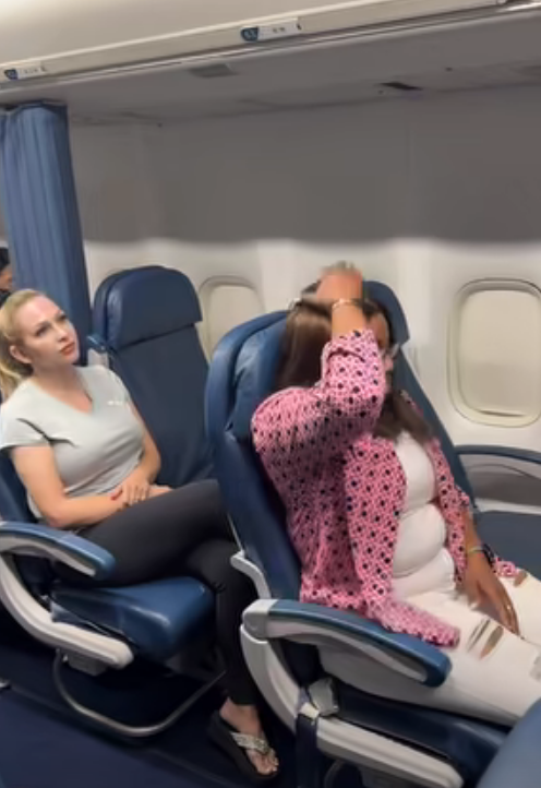 Girl takes her hair off on the plane