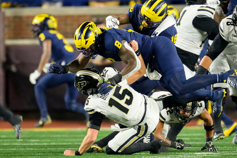 What did Detroit Lions give up to land Michigan DE Derrick Moore?