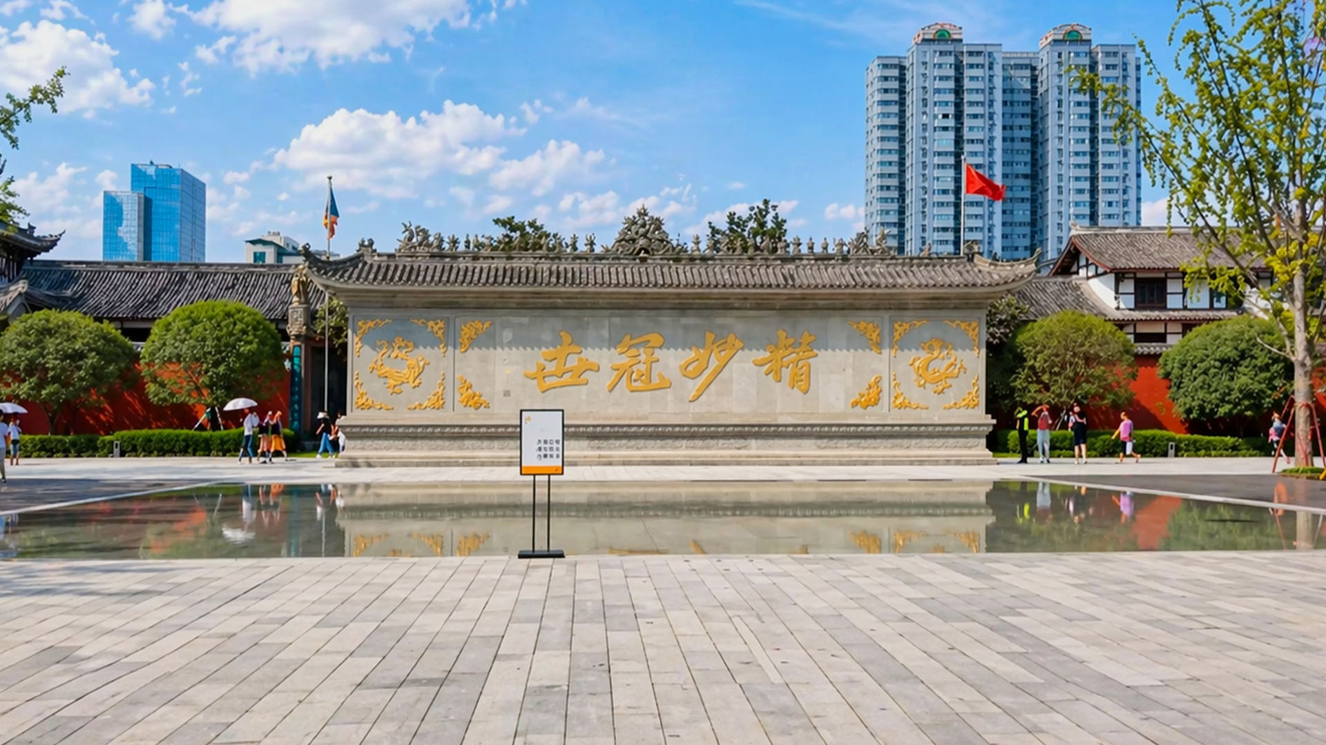 Old style architecture standing quietly while modern towers rise behind it