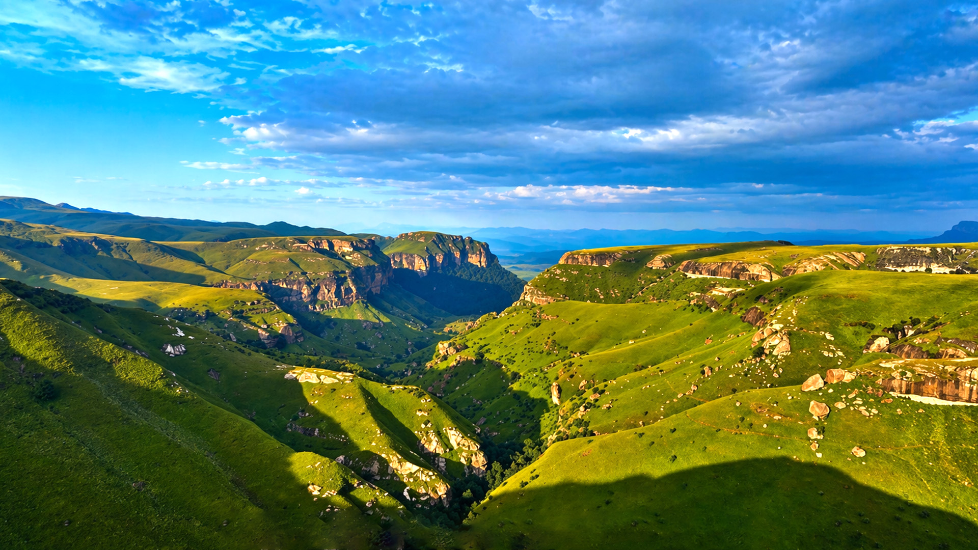 Towering cliffs stretching across a vast mountain range