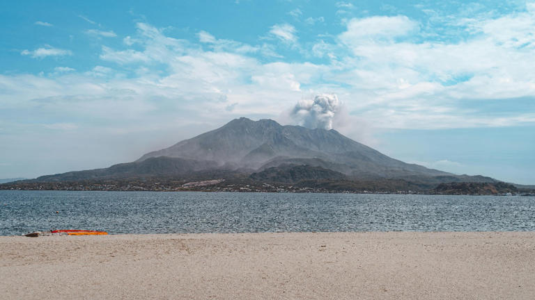 Central Coast beach 'volcano' smoke traced to burning debris in sand