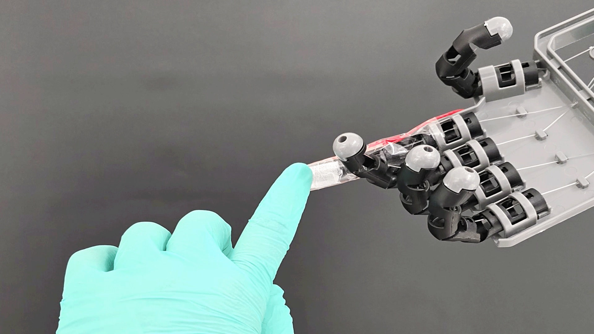 Stretchable electronic skin lets robotic hand feel touch and pressure ...