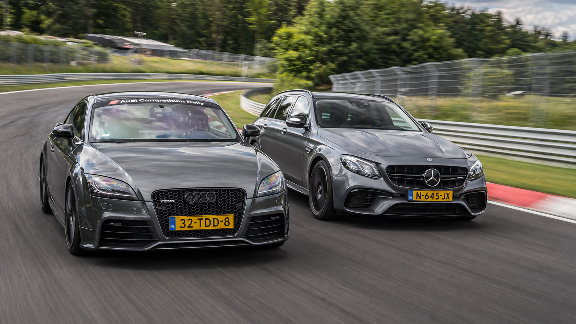 Intense full speed corner battle Audi TT RS against AMG C63 S