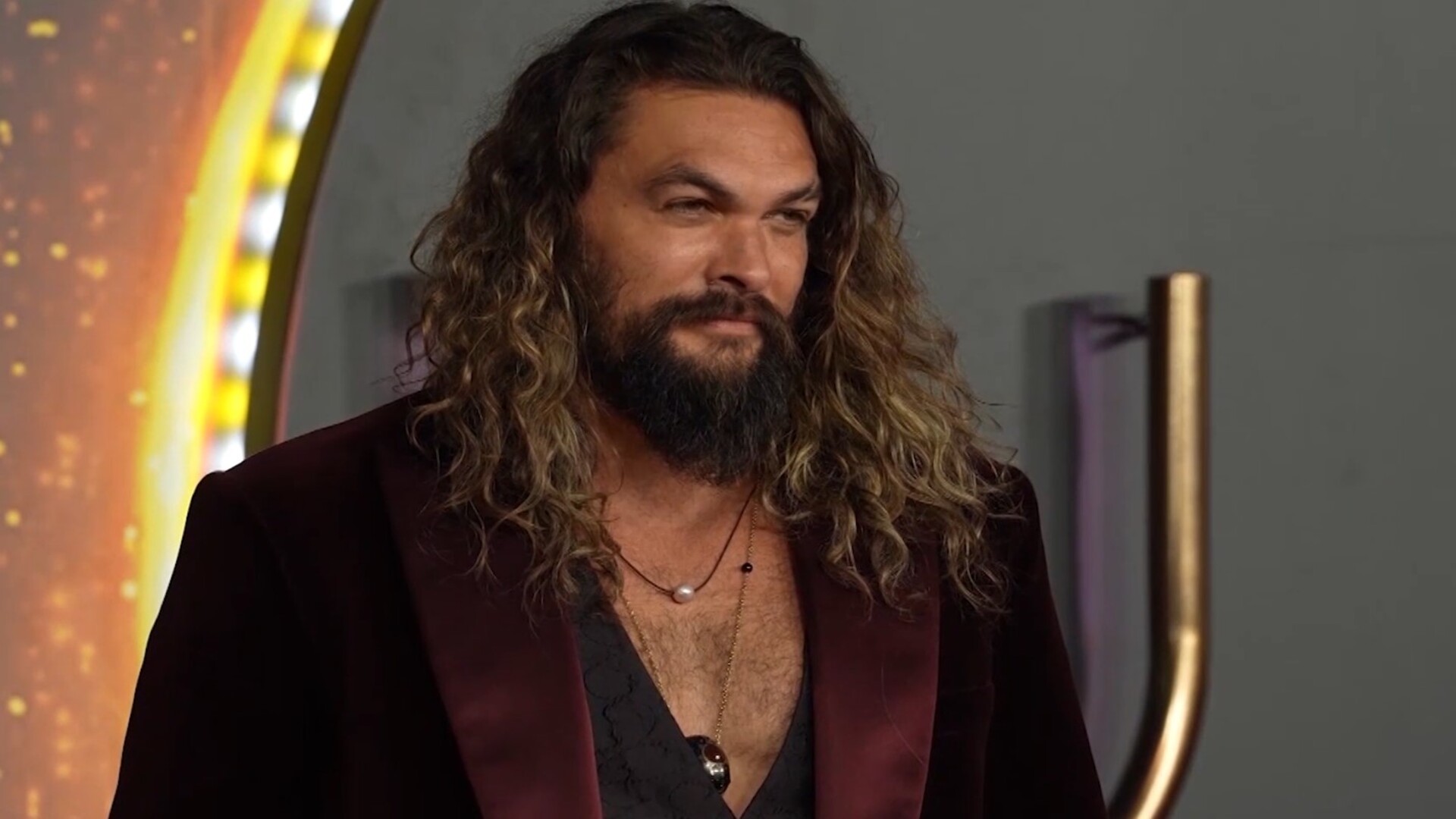 Jason Momoa appears at a red carpet event in stylish look