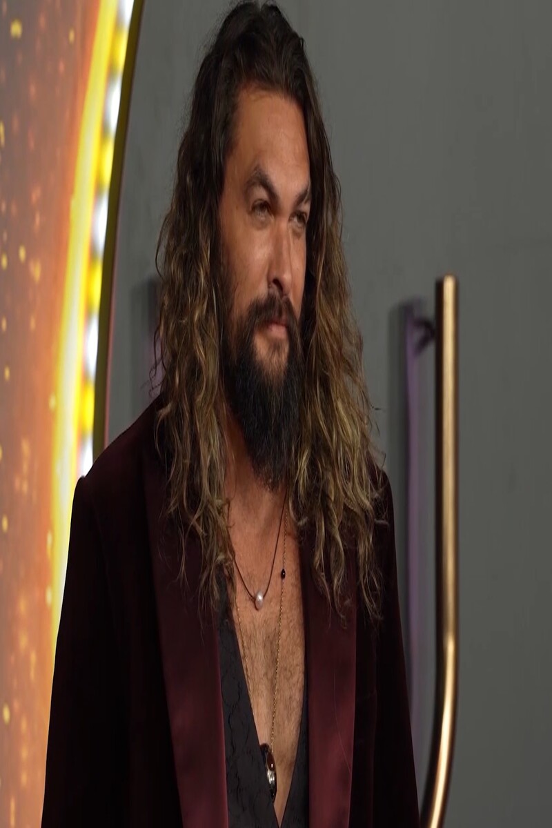 Jason Momoa appears at a red carpet event in stylish look