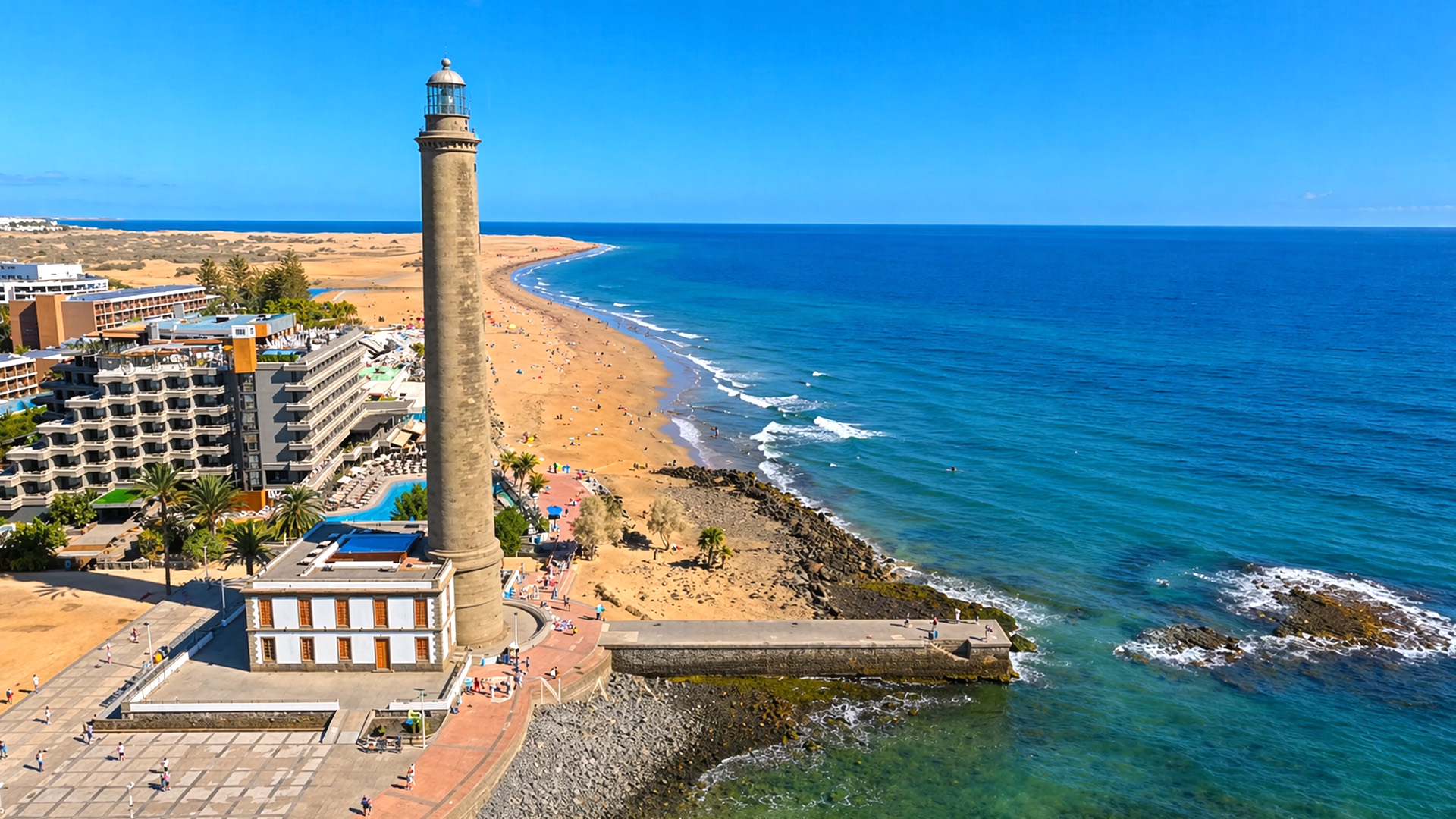 A lighthouse standing on the edge of a coastal cliff