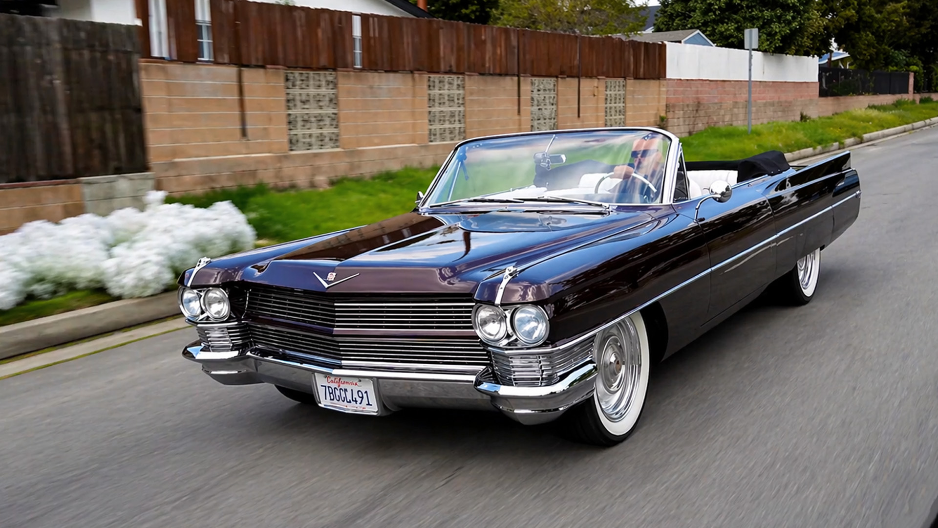 Fully modified classic Cadillac charges down open road