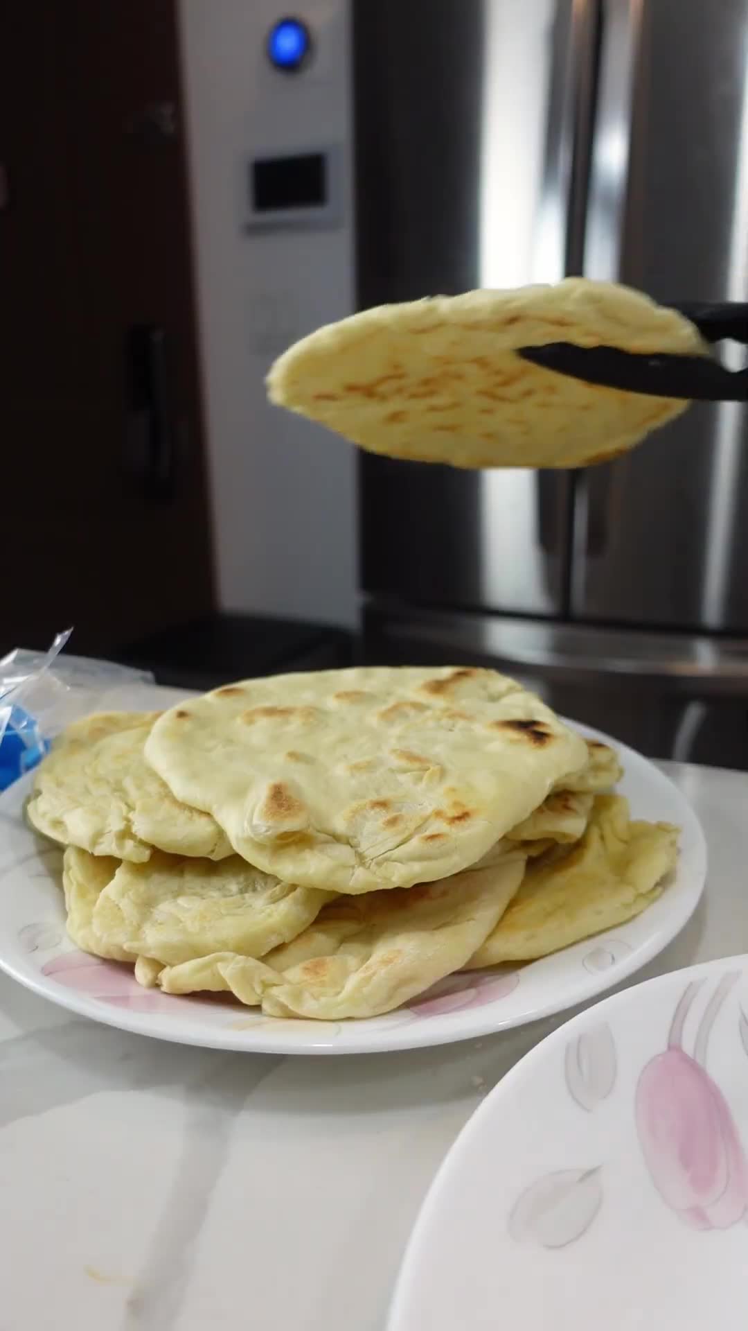 Making warm, fluffy pita at home instead of buying the stale stuff