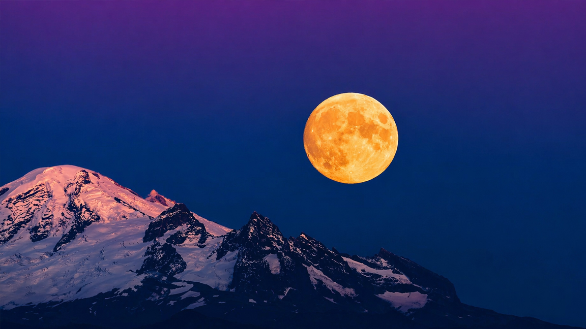 Majestic full moon over dramatic mountain landscape at dusk
