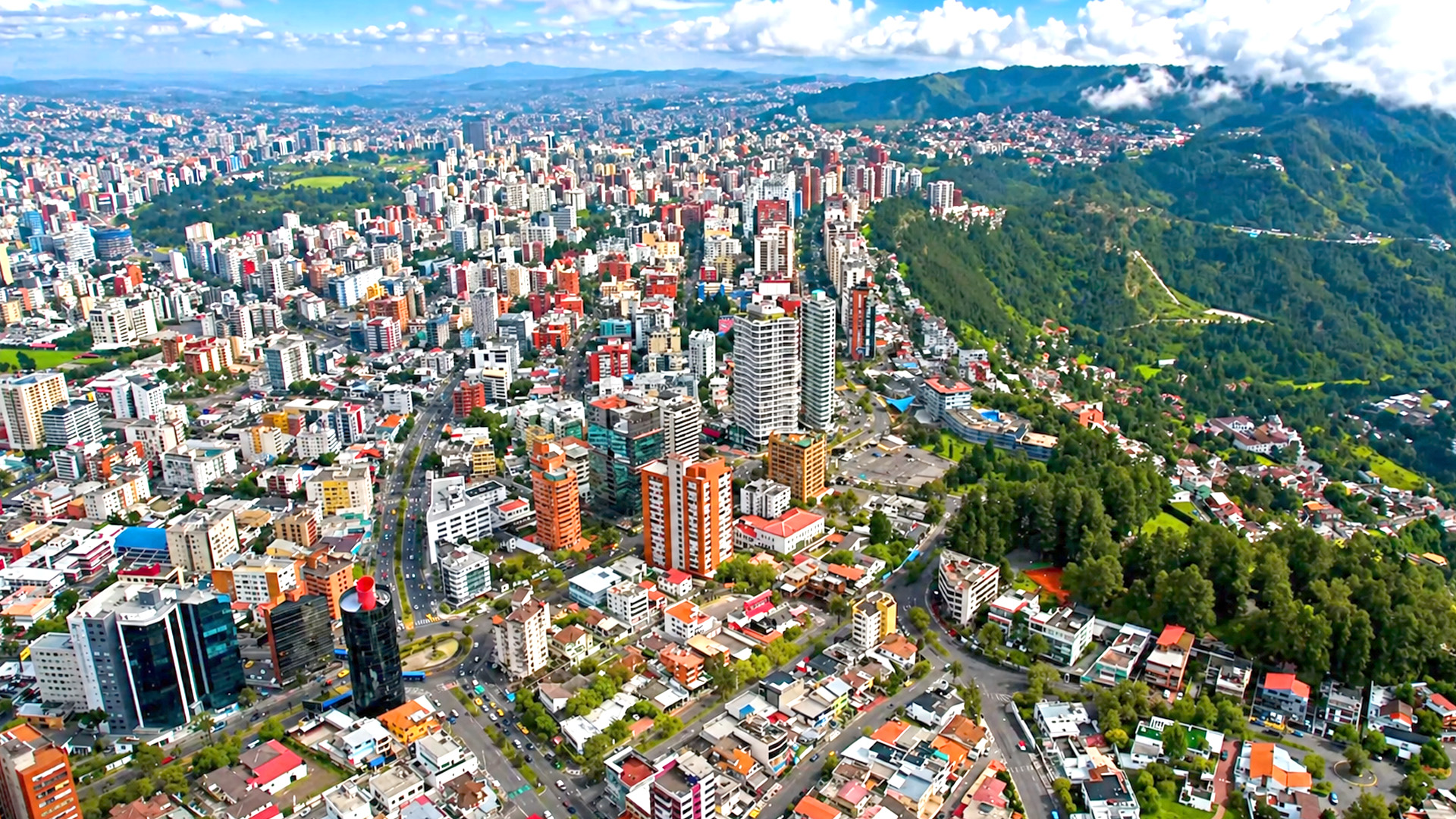 A mountain city tucked between endless green hills