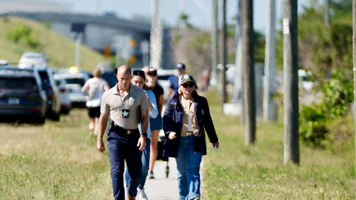 Law enforcement gathered near where divers searched for missing USF student
