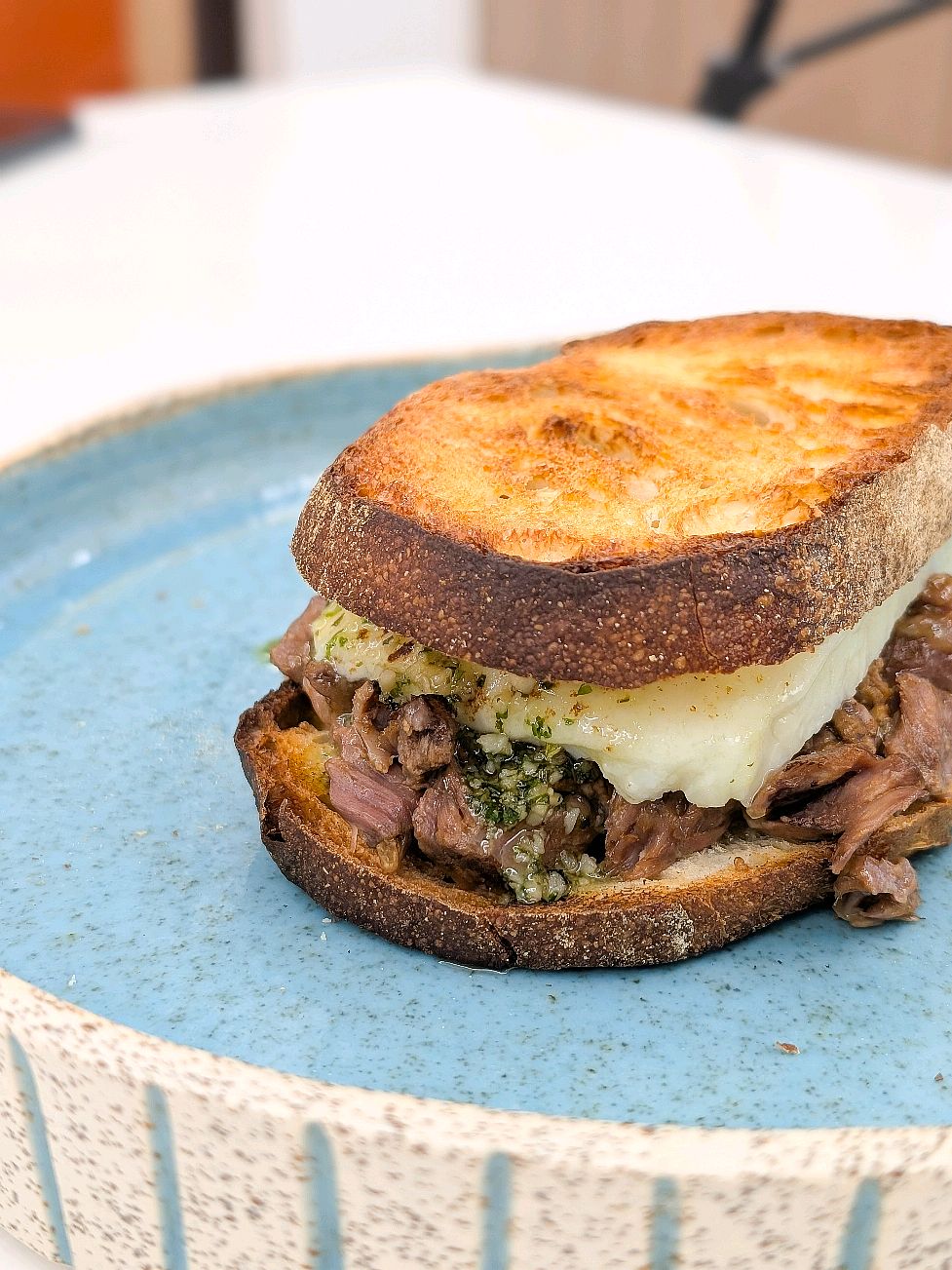 Shredded kansi and kesong puti sandwich unique Filipino recipe