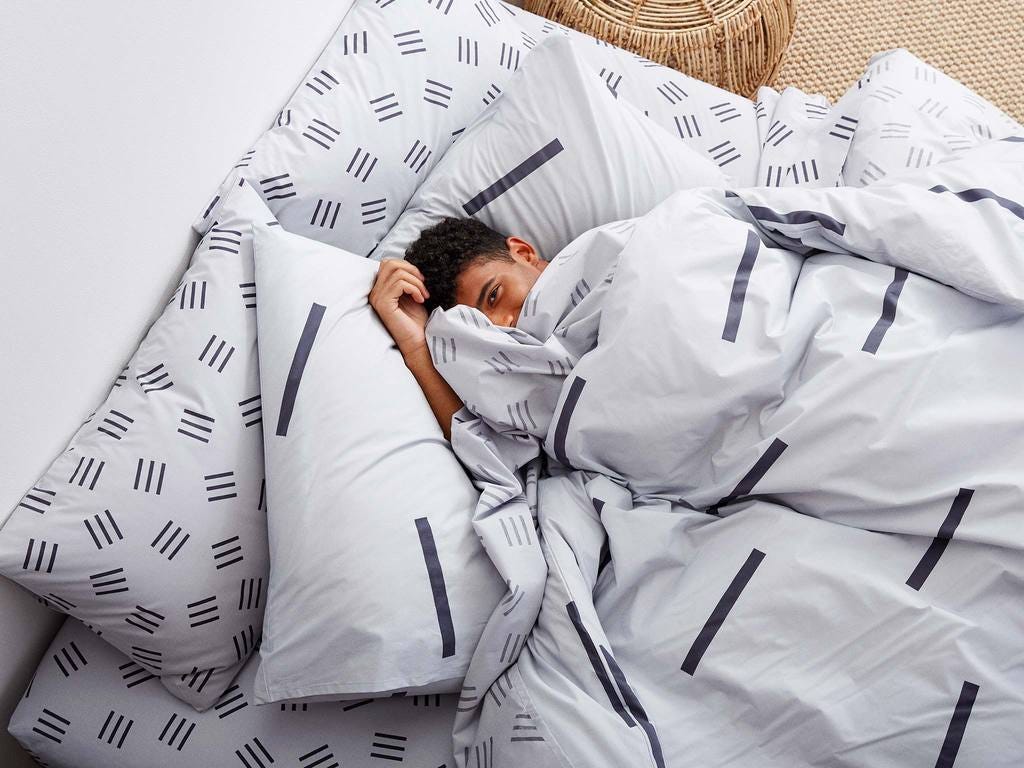 Putting your comforter into a duvet cover is simple — here's how to do it