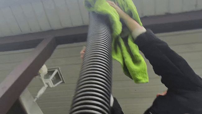 Kitten jumps into rescuer's arms after getting stuck inside pipe