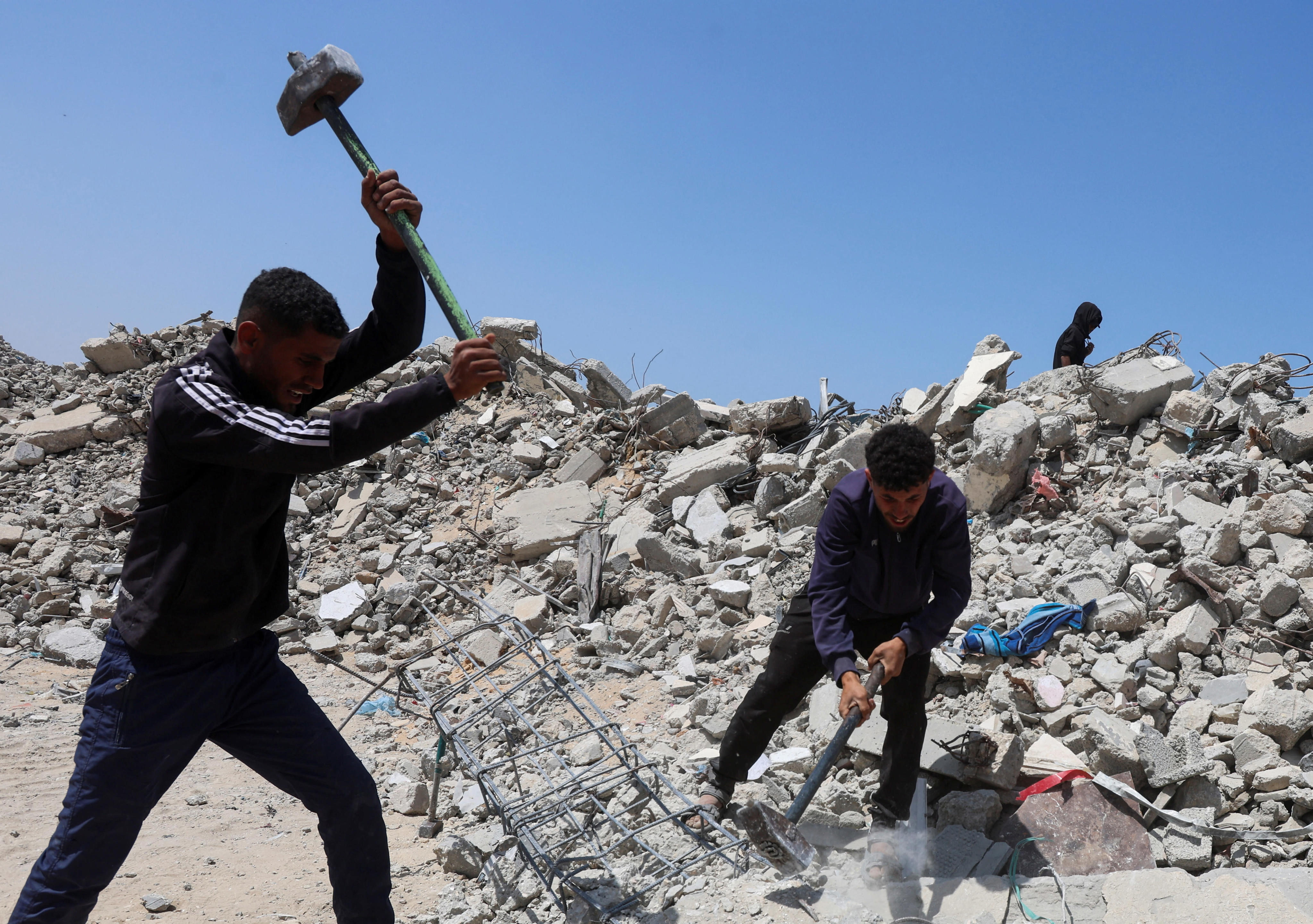 Palestinians use Gaza rubble to restore streets as US rebuilding plan ...