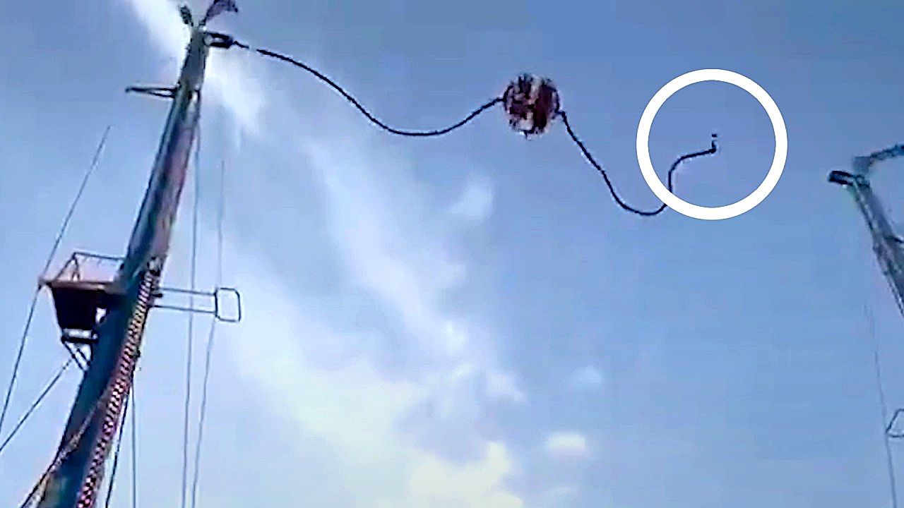 Slingshot ride cable snaps midair at fairground in Spain
