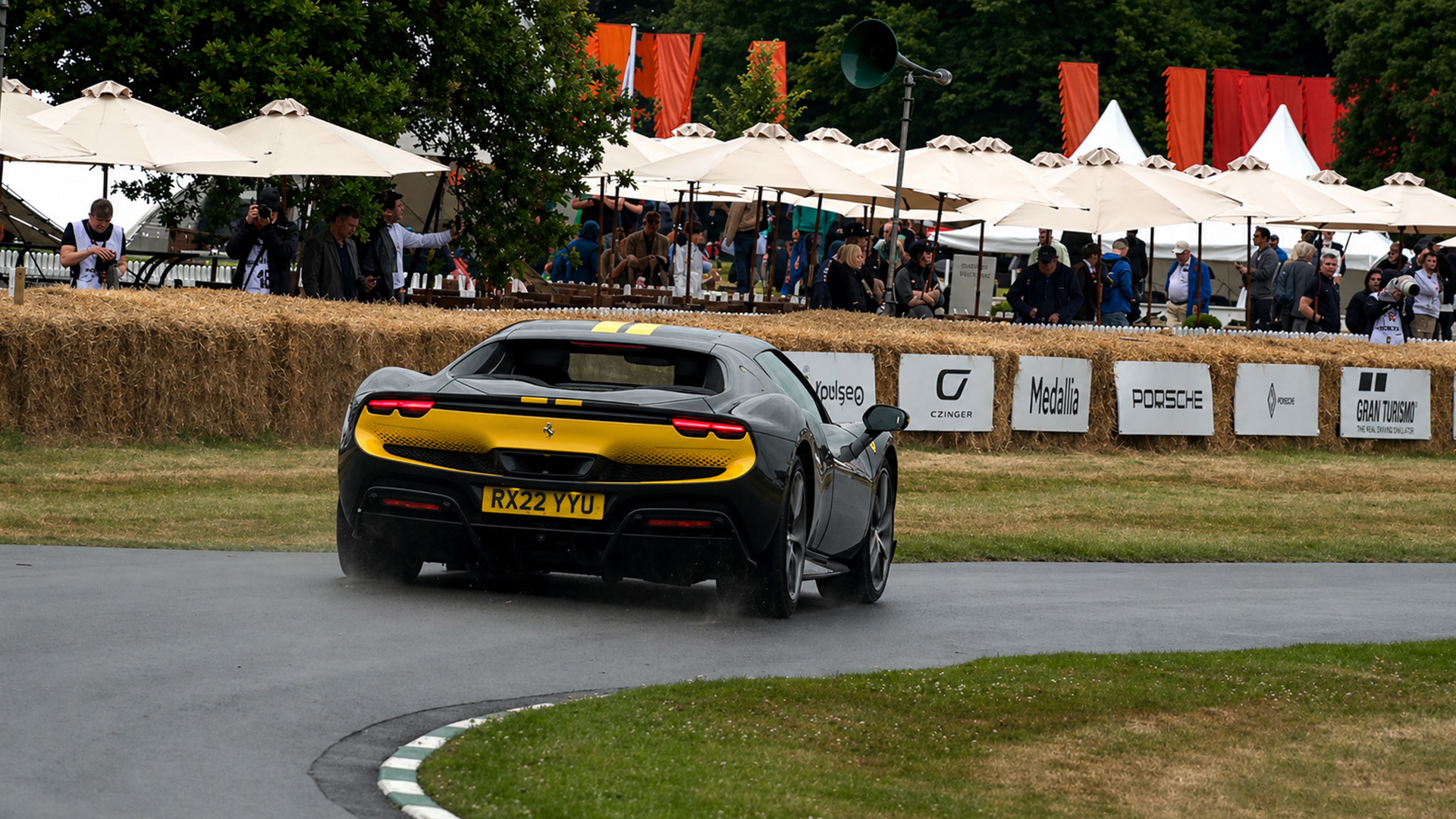 Ferrari 296 almost loses grip on race track corner