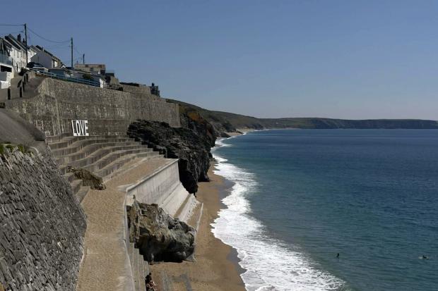 Porthleven smiles as festival sign letters pop up on the beachfront