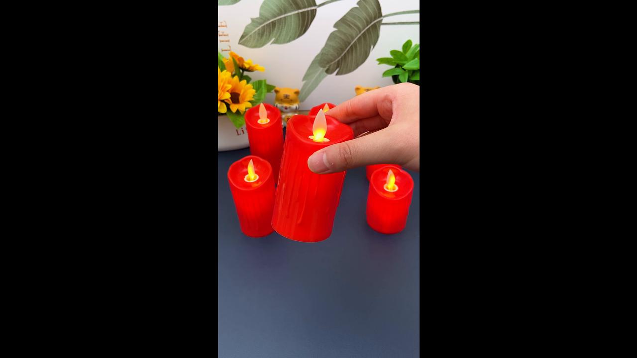 Lighting red LED candle set with flickering flame effect resulting in ...