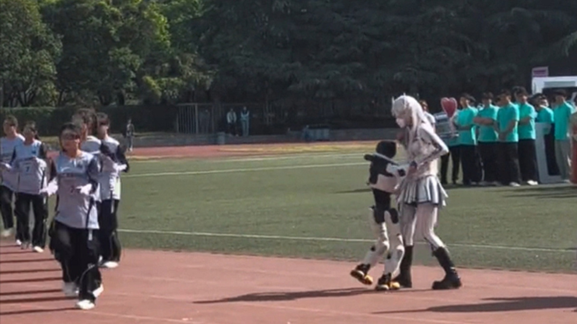 Bizarre scene as humanoid robot decides to hug student mid dance ...