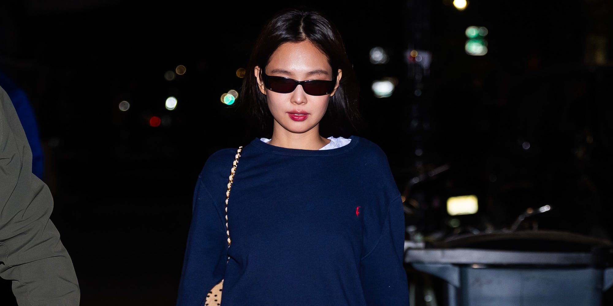 Jennie’s preppy off-duty fit comes equipped with two playful prints