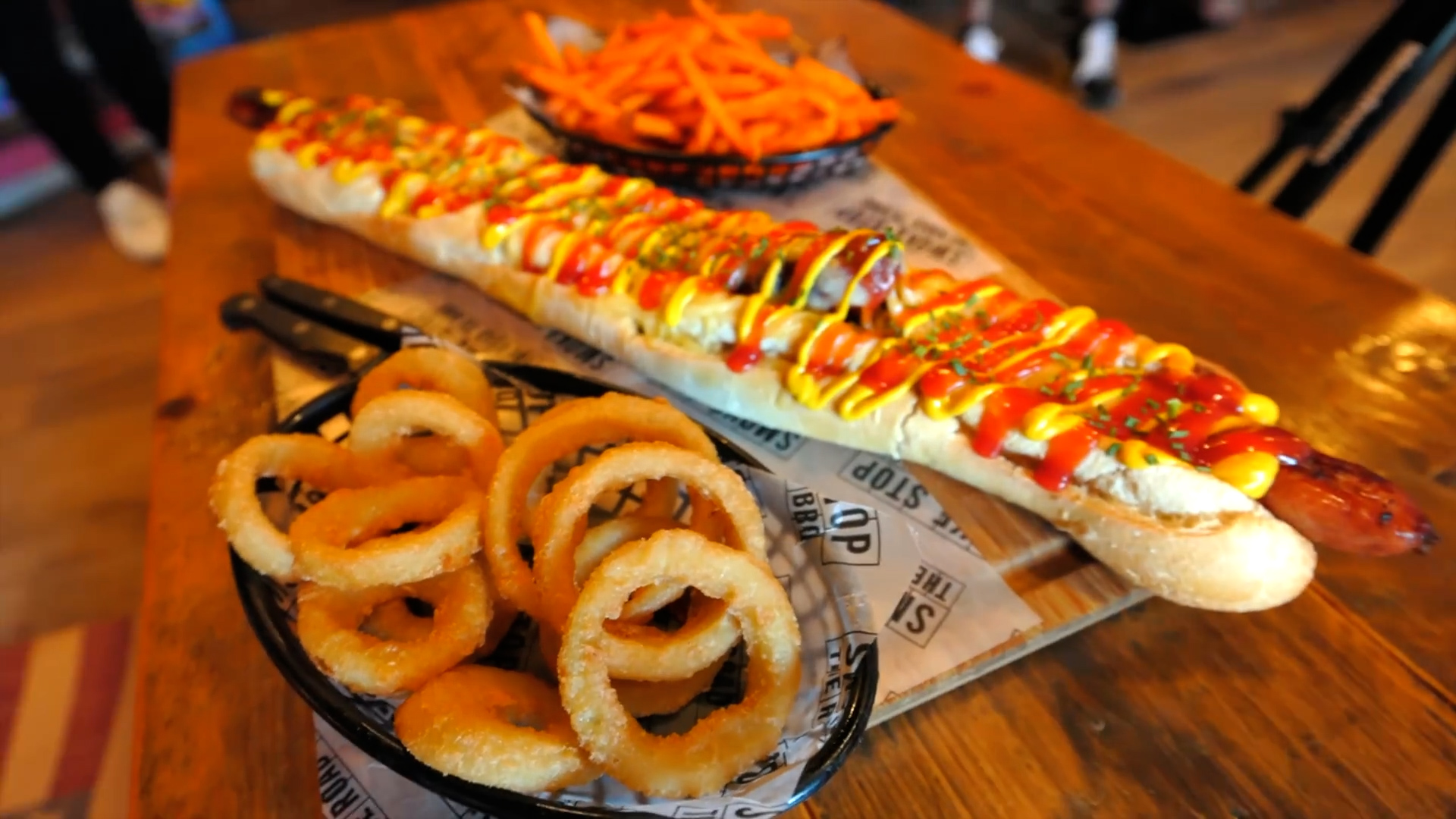 Woman attempts impossible 2ft cheesy hot dog challenge