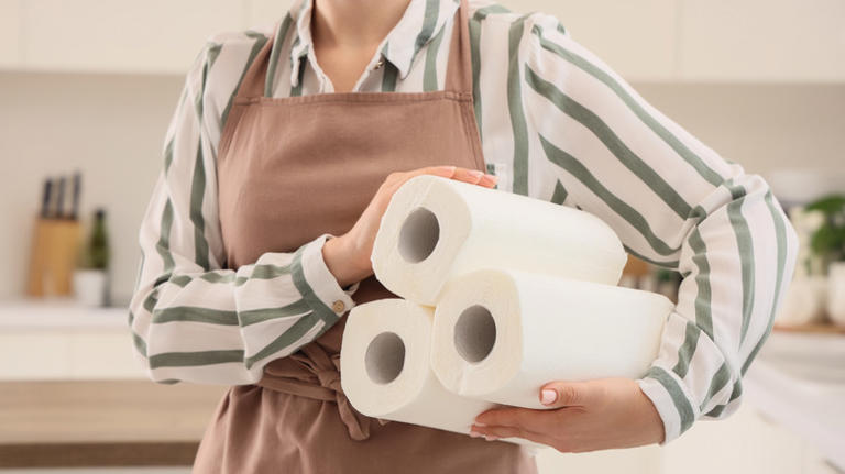 The simple shelf DIY that keeps spare paper towels neat and organized