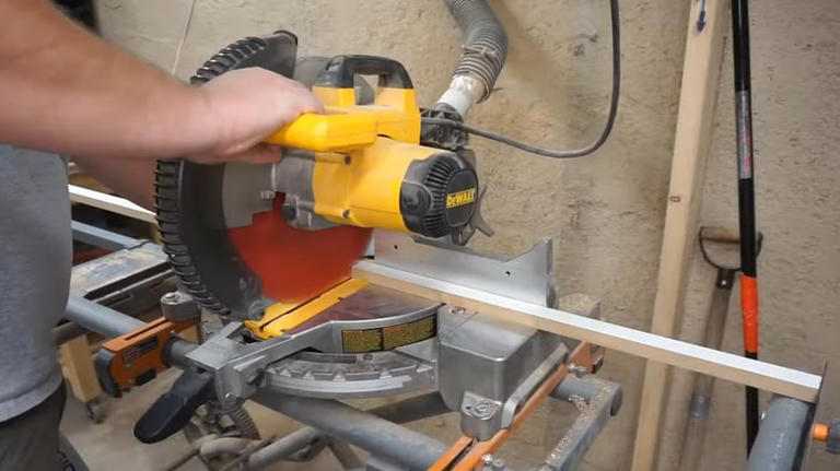 The simple shelf DIY that keeps spare paper towels neat and organized