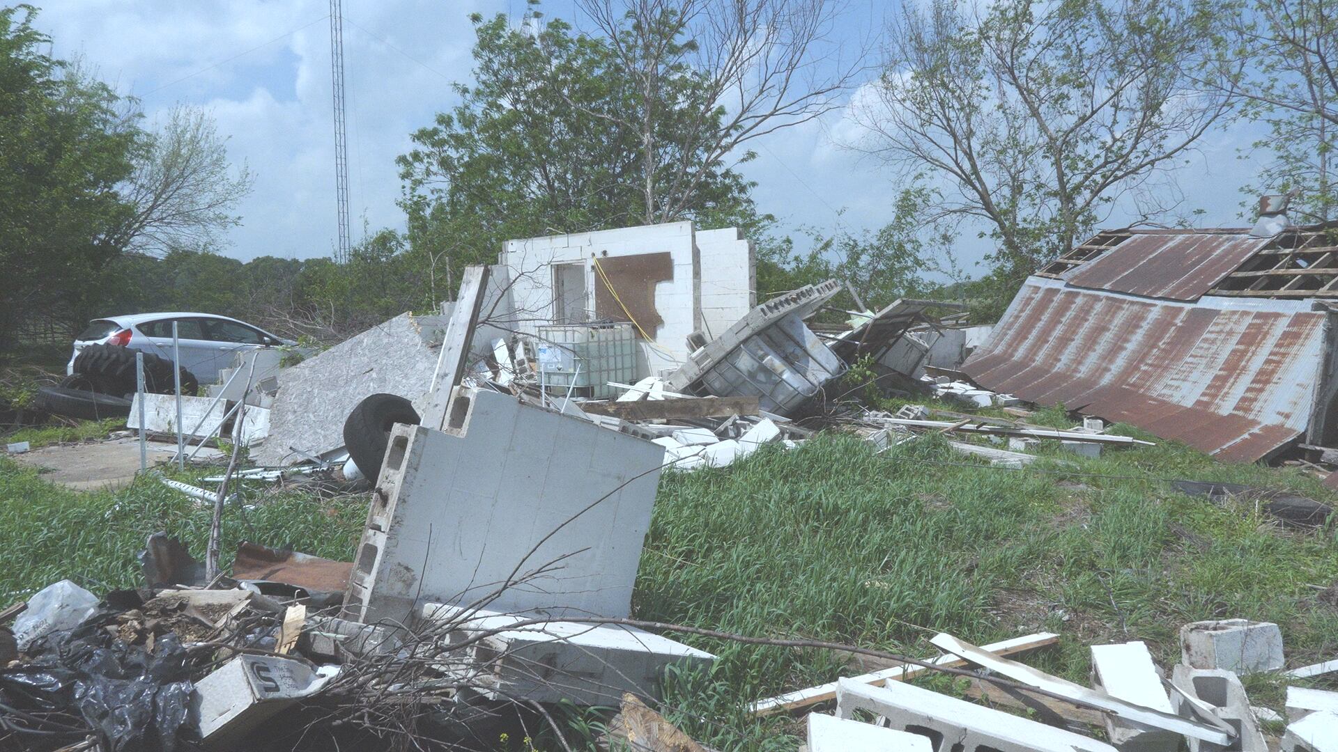 Family begins cleanup after storm destroys farm buildings north of ...