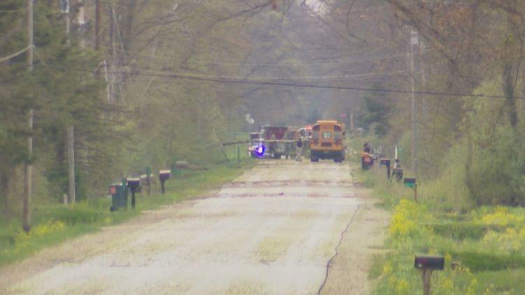 Howling winds knock down power lines trapping 2 students, driver inside ...