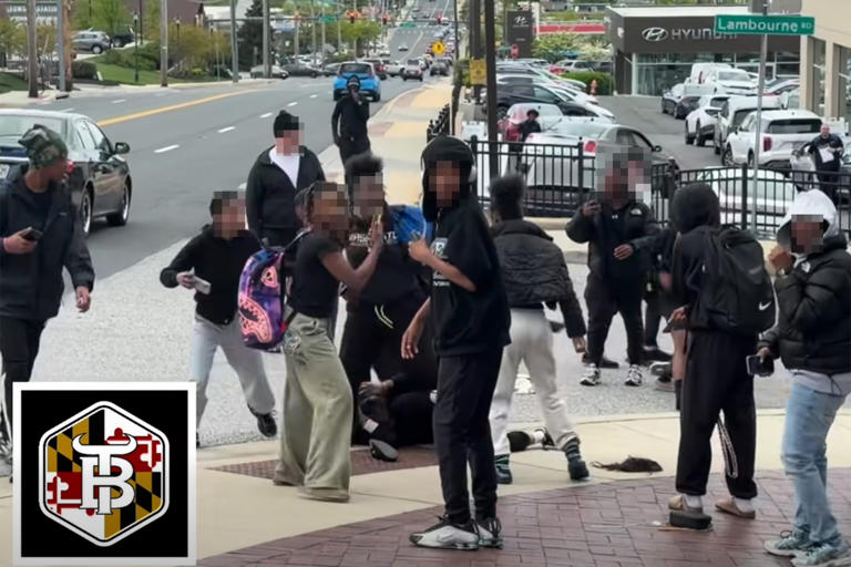 Swarm of middle schoolers laugh, smile at camera as brawling peers ...