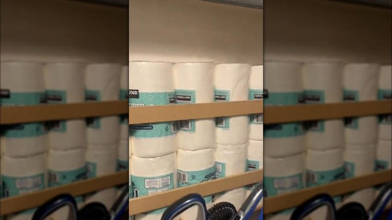 The simple shelf DIY that keeps spare paper towels neat and organized
