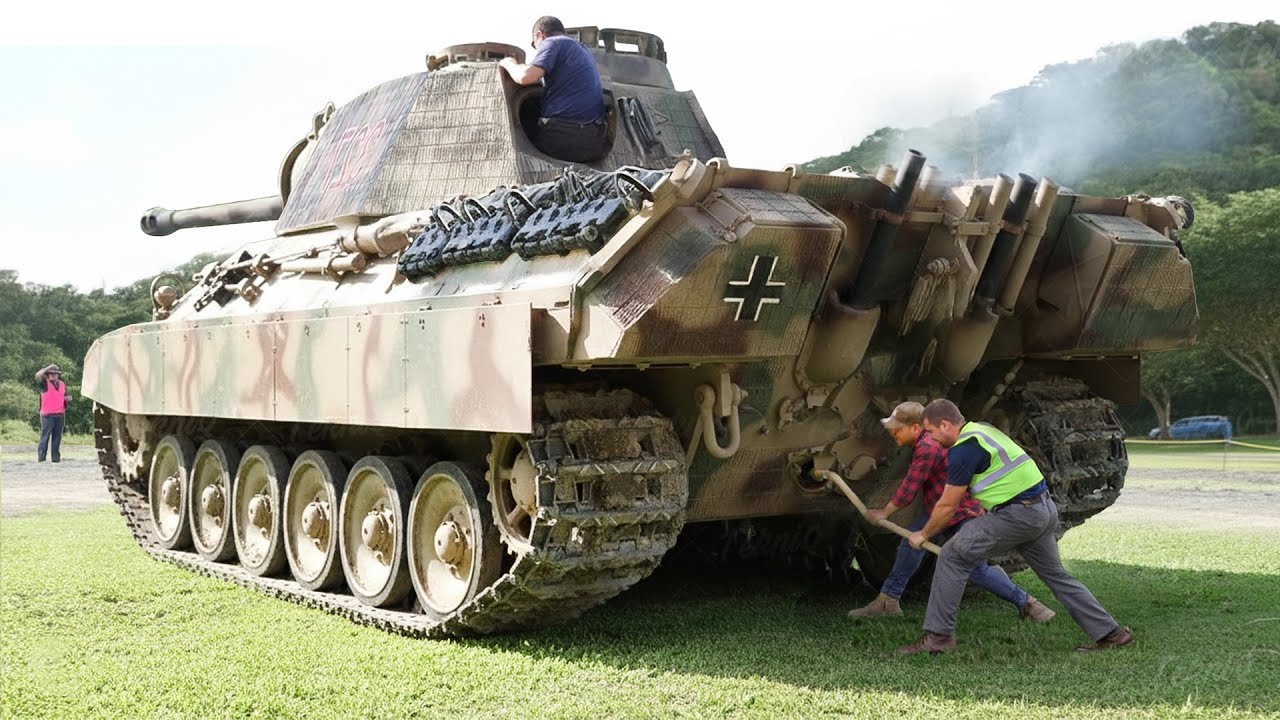 Hand starting massive WW2 tank with crazy engine sound